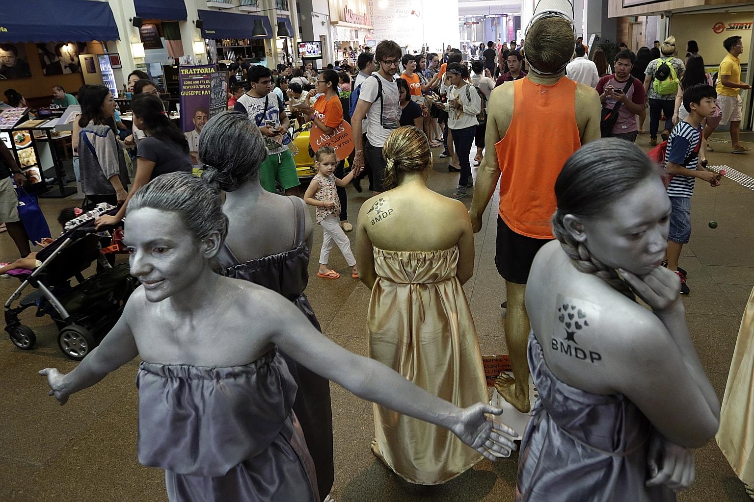 Human statues make stand on bone marrow donation | The Straits Times