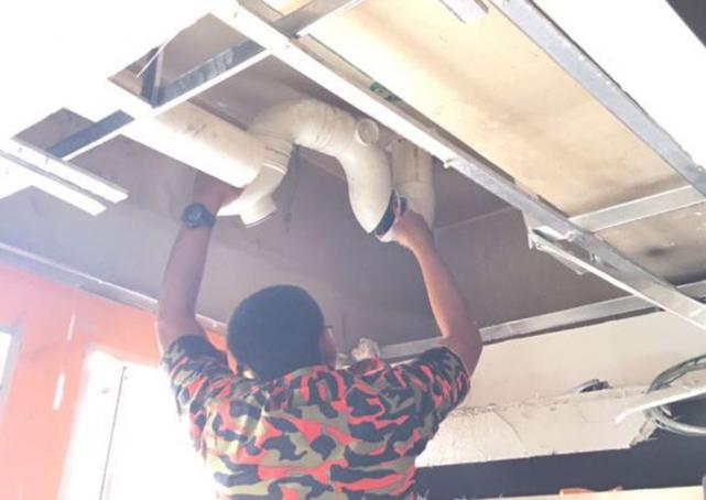 Woman in Malaysia gets hand stuck in toilet while trying to recover ...