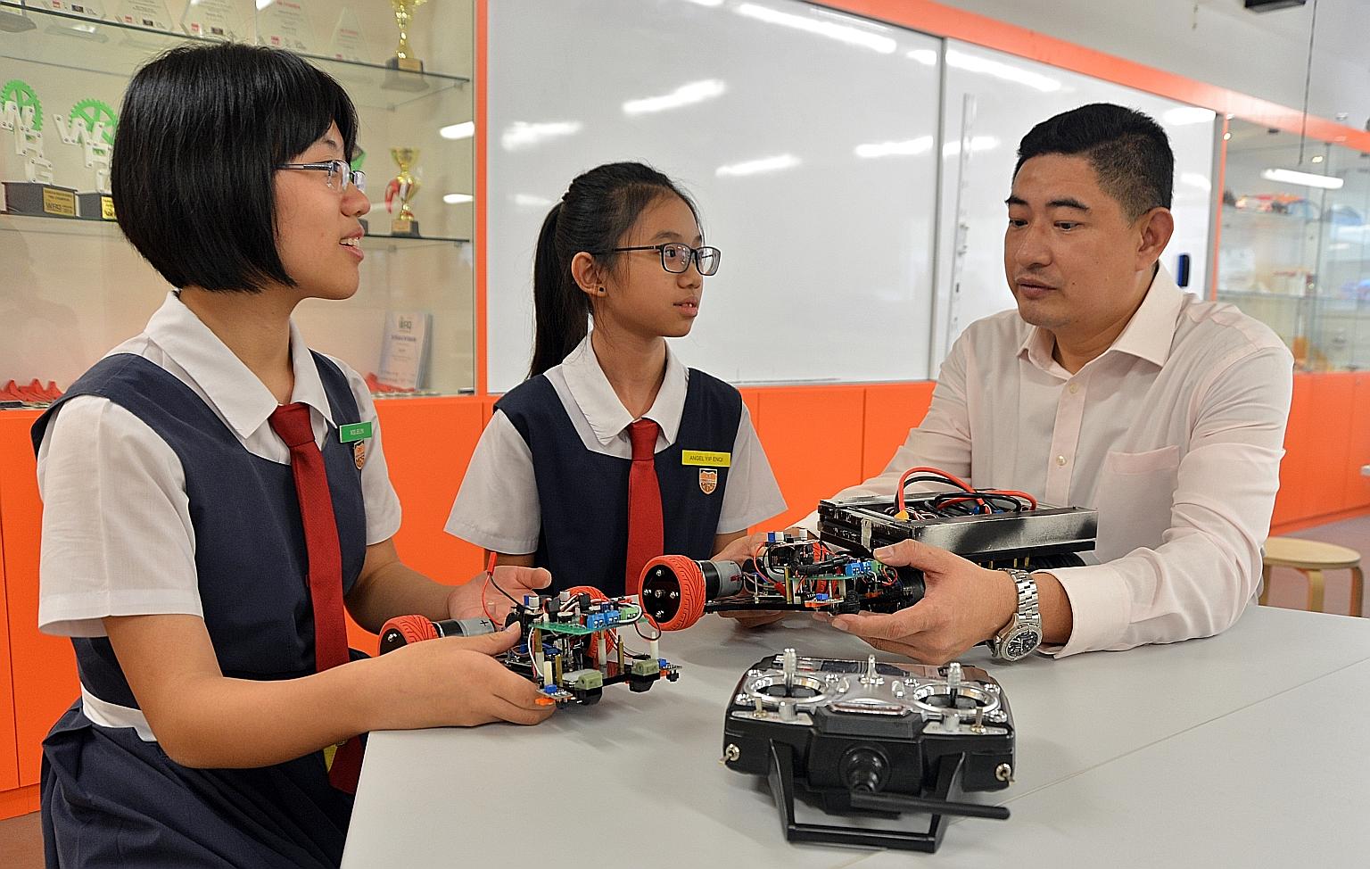 Building on their interests at school's robotics club | The Straits Times