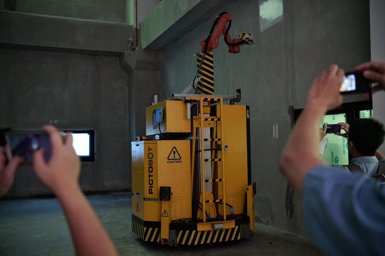 Saving time and manpower with Singapore-developed spray painting robot ...