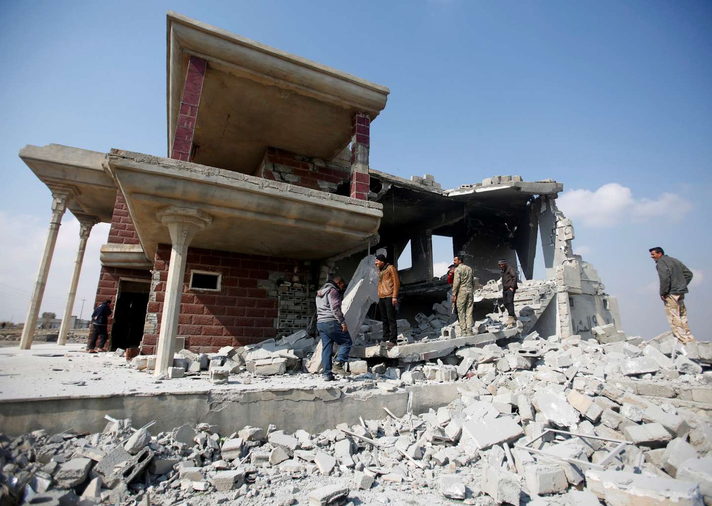 Blowing up houses, digging up graves: Iraqis purge the vestiges of ISIS ...
