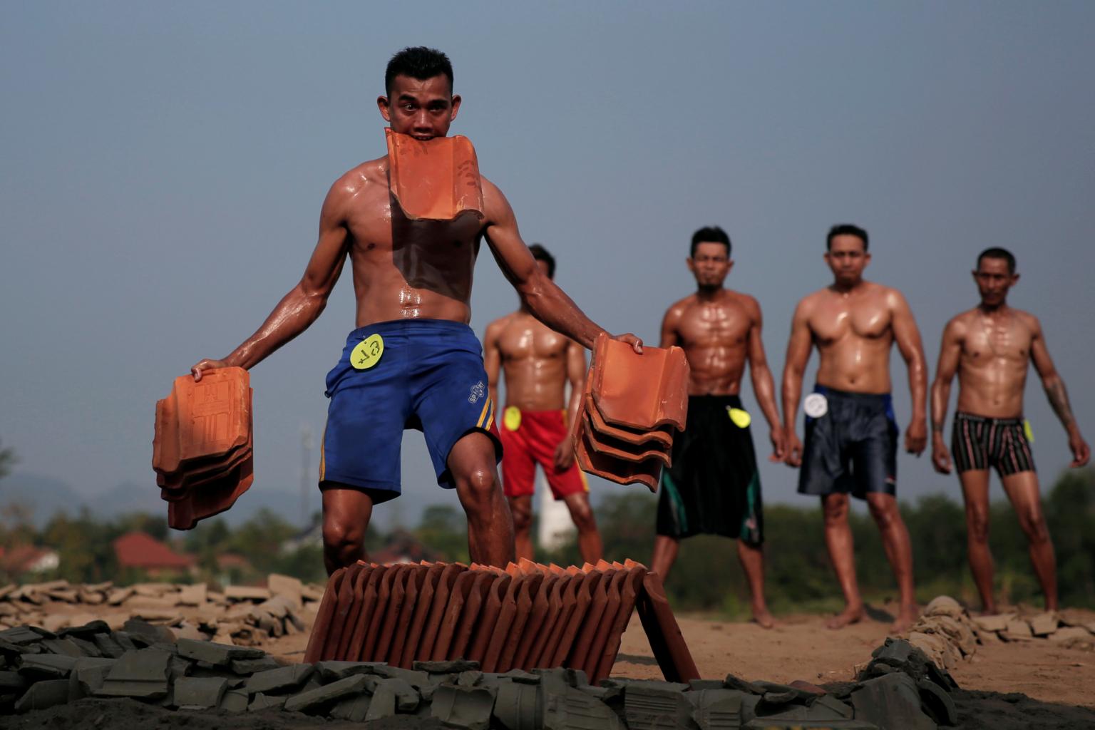 Indonesian tile workers' toned torsos on display for Independence day ...