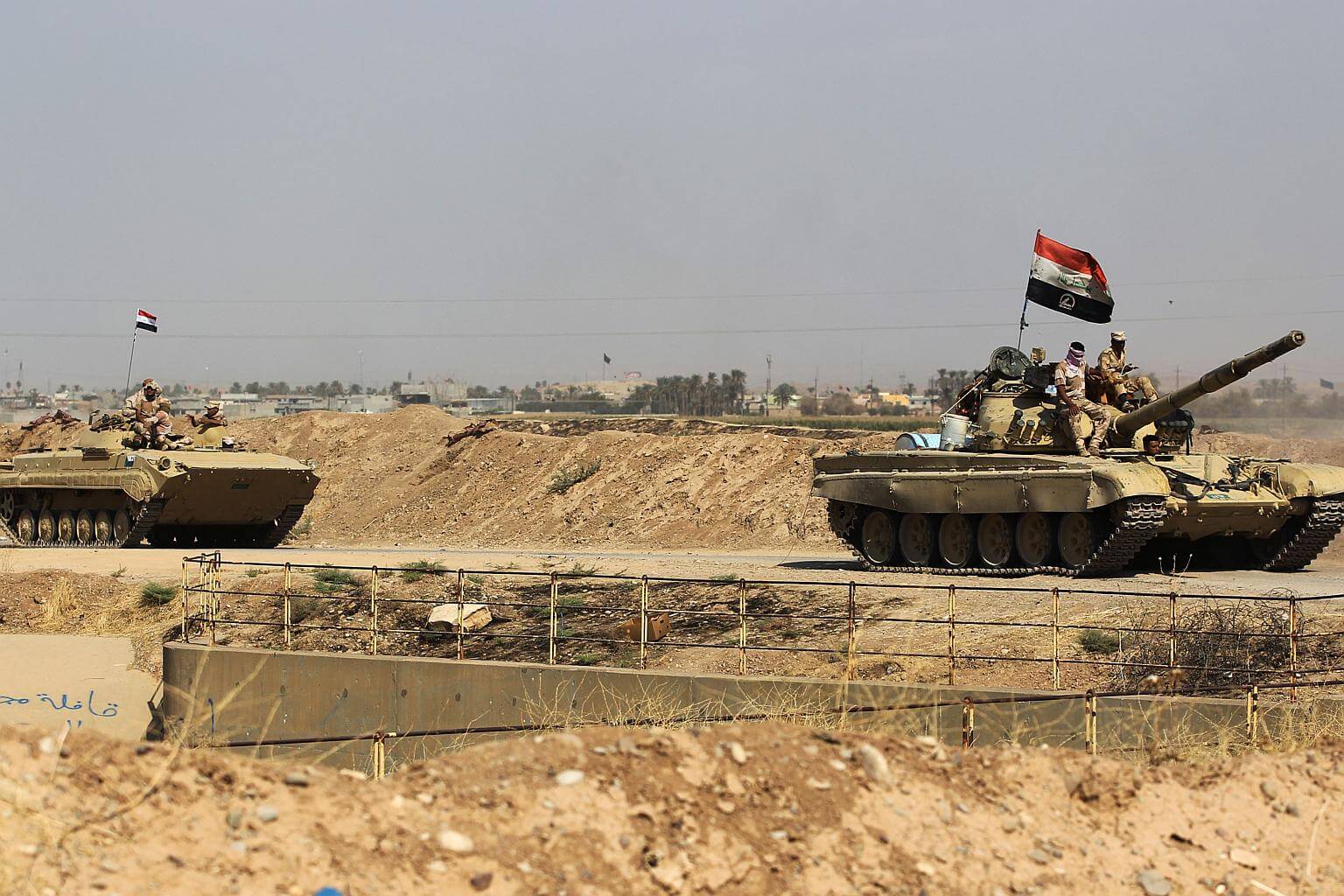 Iraqi Kurds say Baghdad will pay heavy price for assault in ...