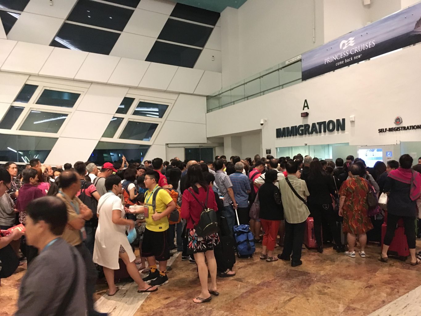 Long queues at Marina Bay Cruise Centre due to boarding delays for ...