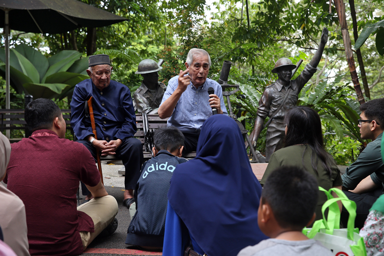 Sharing stories of the war and racial riots with the younger generation ...