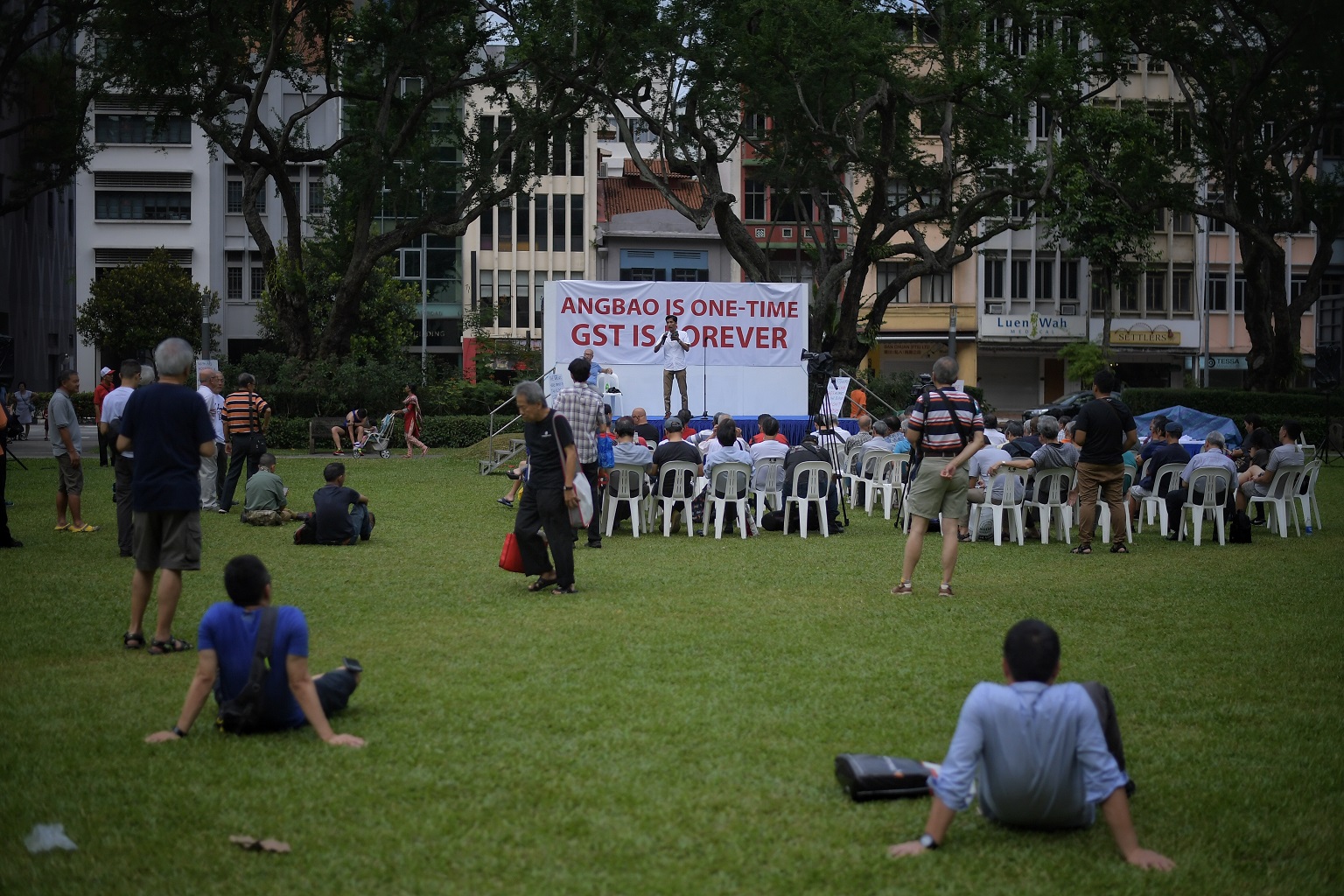 Amid drizzle, protest on GST hike draws 120 to Hong Lim Park | The ...