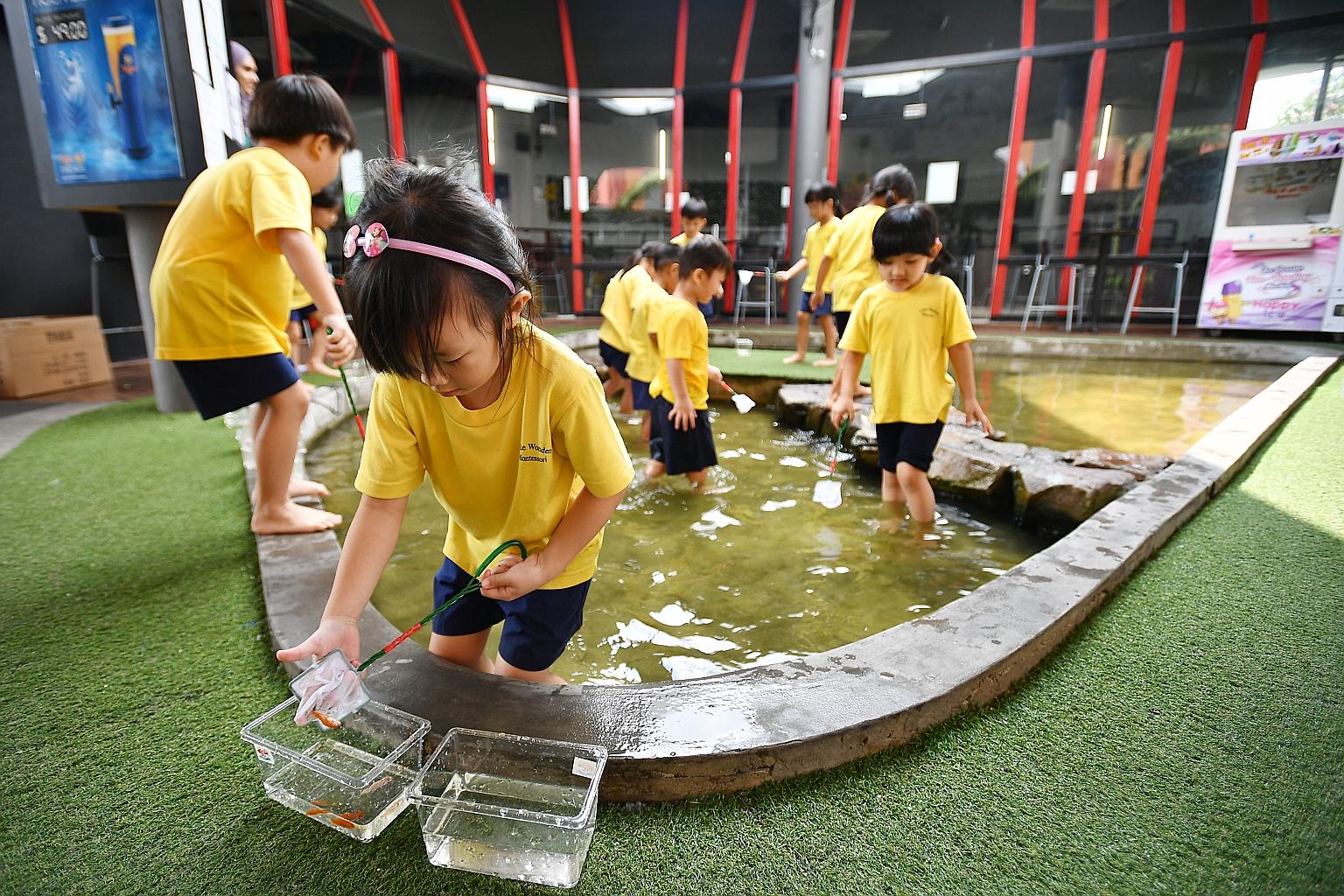 Children hooked by a pastime of old - longkang fishing | The Straits Times