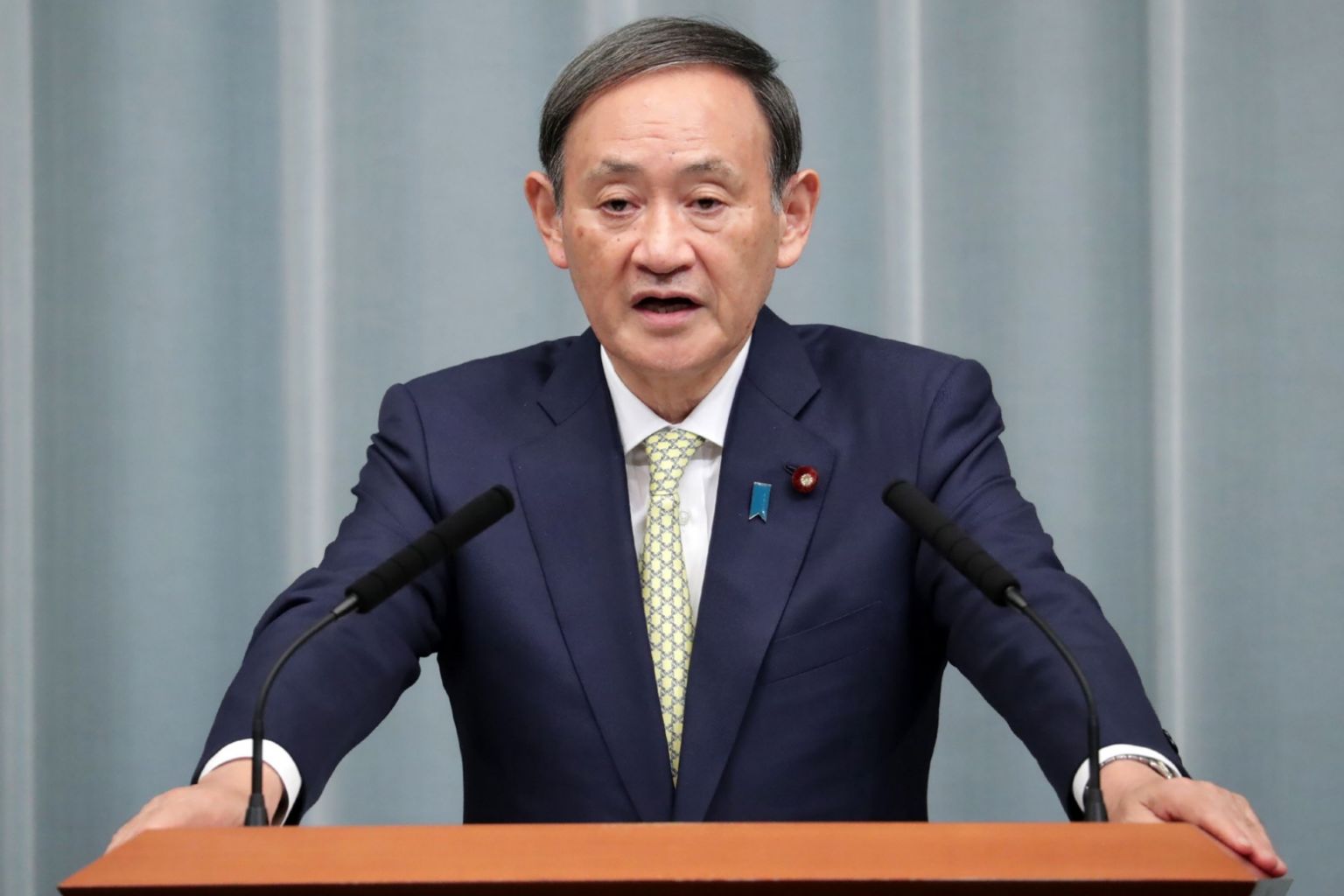 Cabinet secretary Suga says Japan wants to promote free and fair trade ...