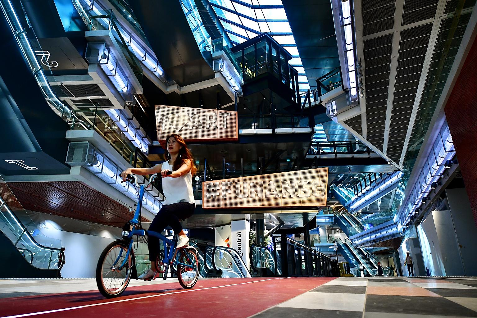 New Funan mall lets cyclists ride through it | The Straits Times