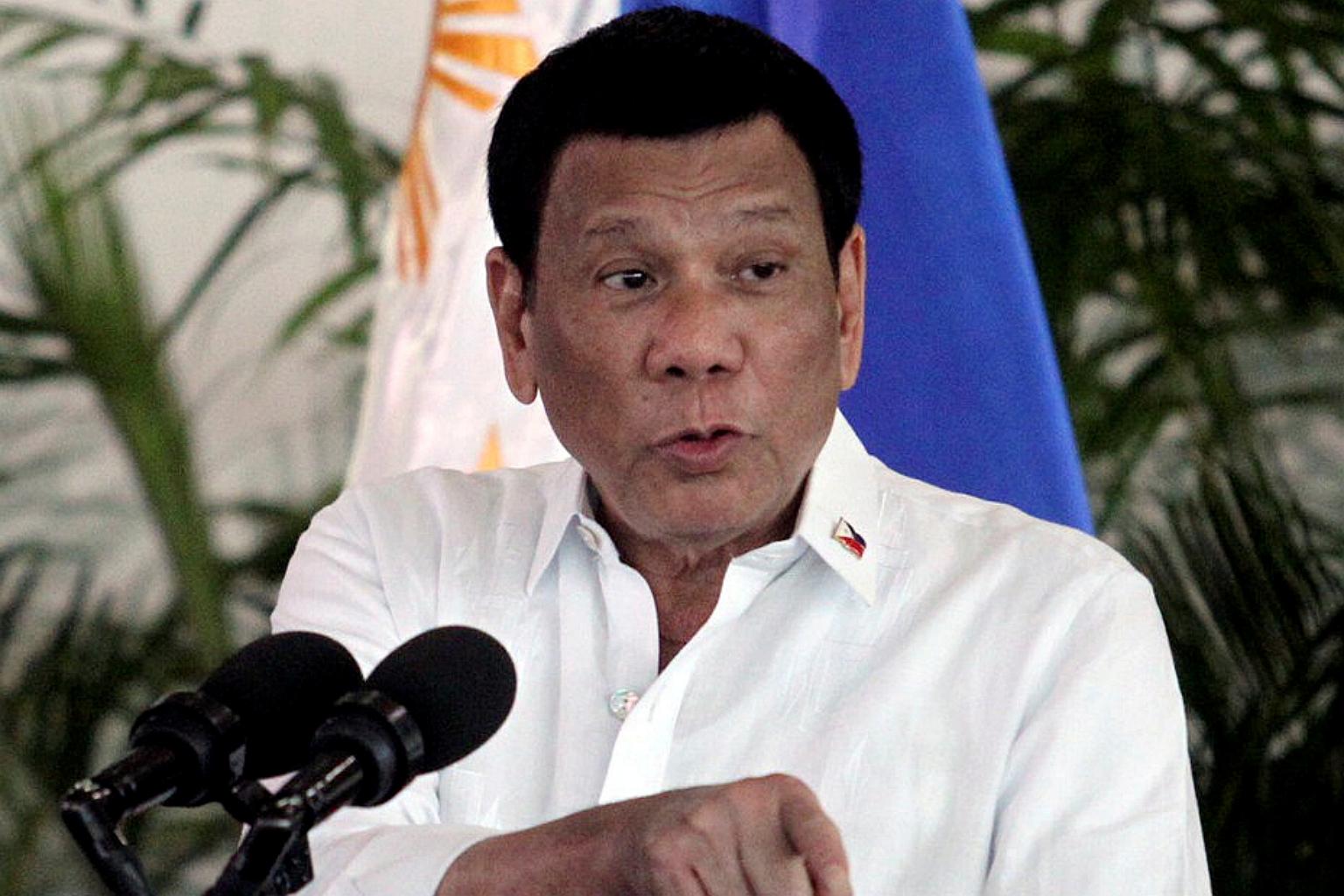 Philippine President Rodrigo Duterte resting after a minor motorcycle ...