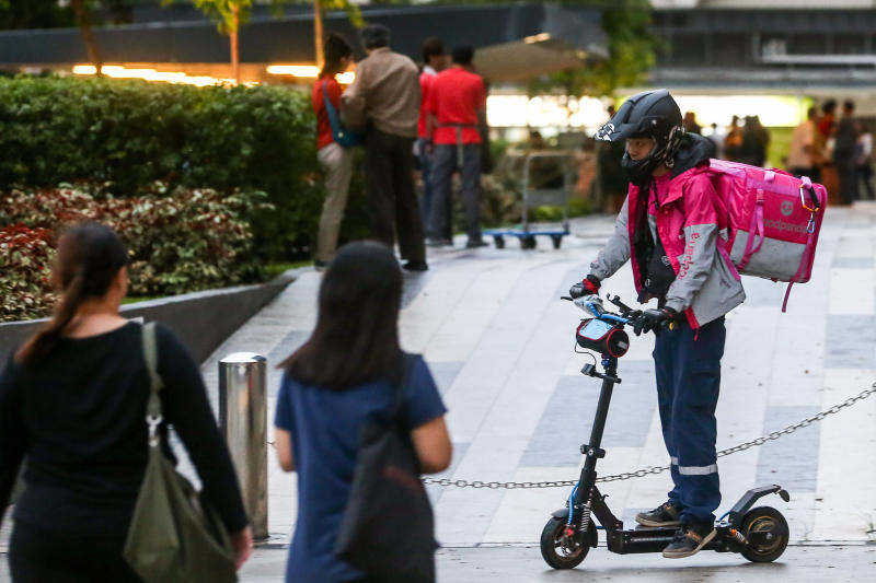 First batch of food delivery riders receive LTA's approval to trade in ...