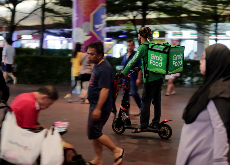 Grab to review use of e-scooters in food delivery | The Straits Times