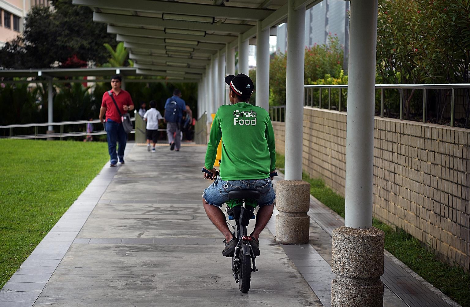 GrabFood to review use of e-scooters for deliveries | The Straits Times