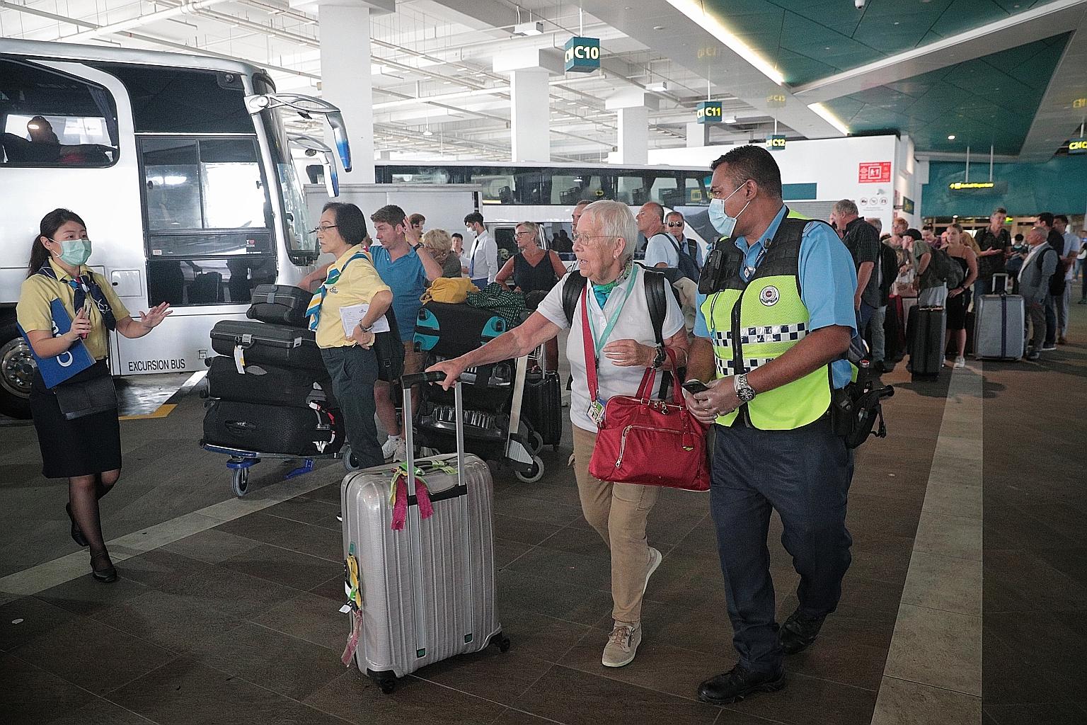 Cruise ship passengers on way home after landing in Singapore | The ...