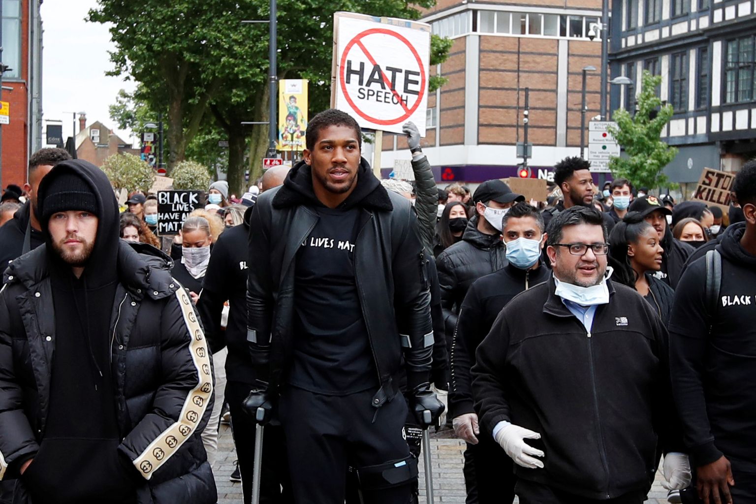 Boxing: Joshua knee brace, crutches at protest march 'precautionary ...