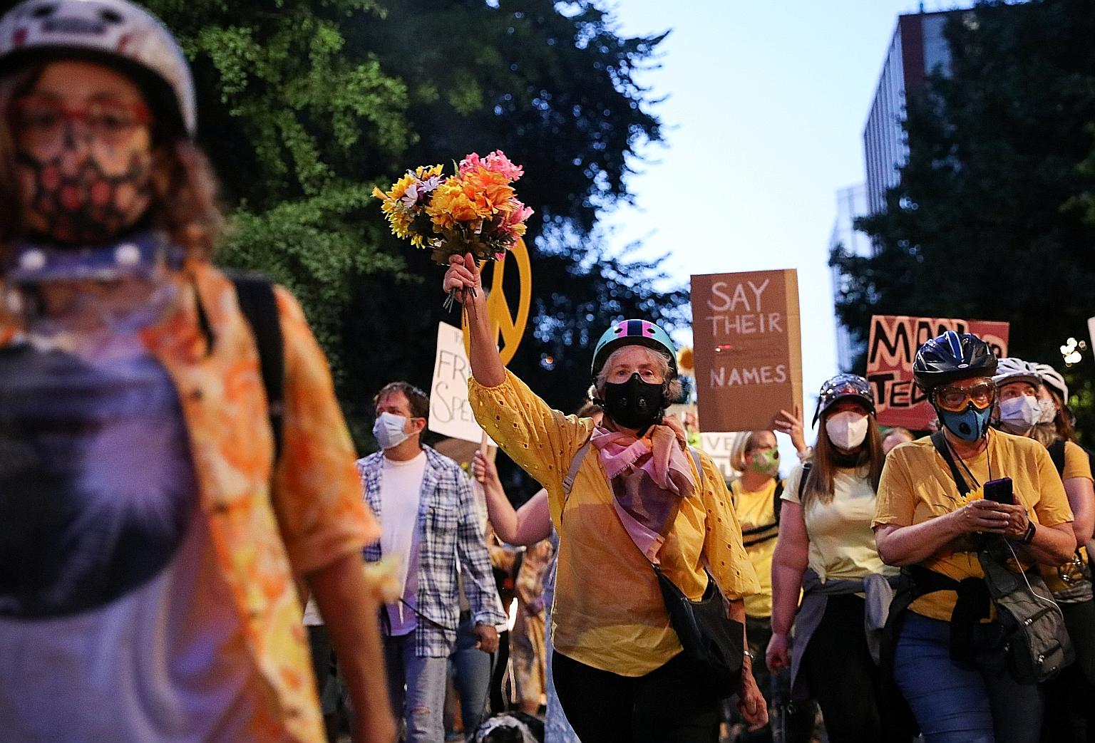 Mothers across US stand up to federal agents at protests | The Straits ...
