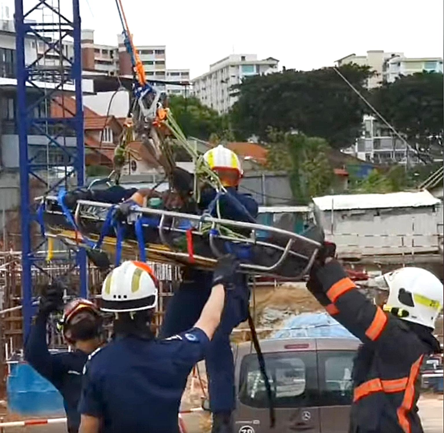 SCDF rescues worker stuck 40m up on crane | The Straits Times