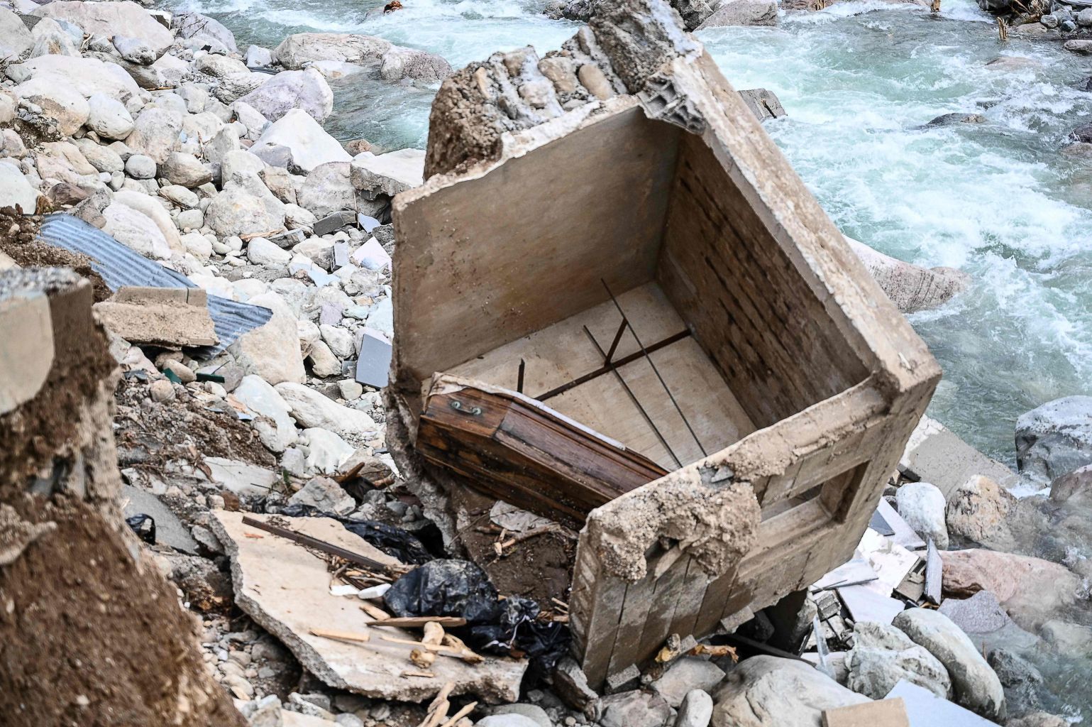 'There's no one left': Violent floods sweep bodies from cemetery in ...