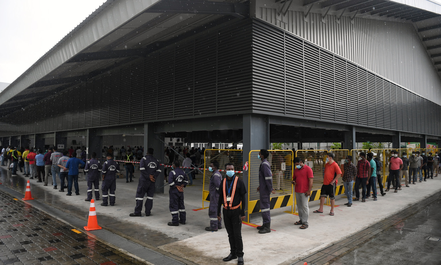More swab test facilities for migrant workers by year end | The Straits ...
