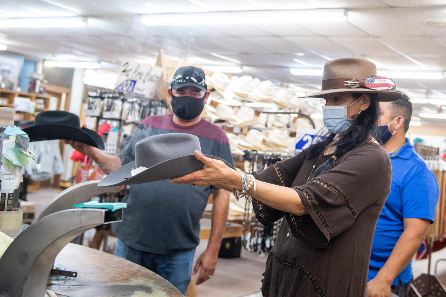 Staff at some major US firms to keep masks on in Texas even as state ...