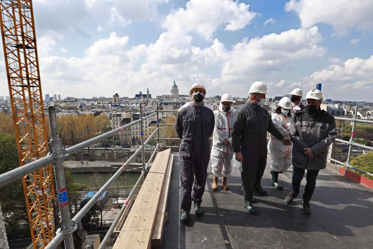 Macron scales Notre-Dame's rooftop two years after cathedral fire | The ...