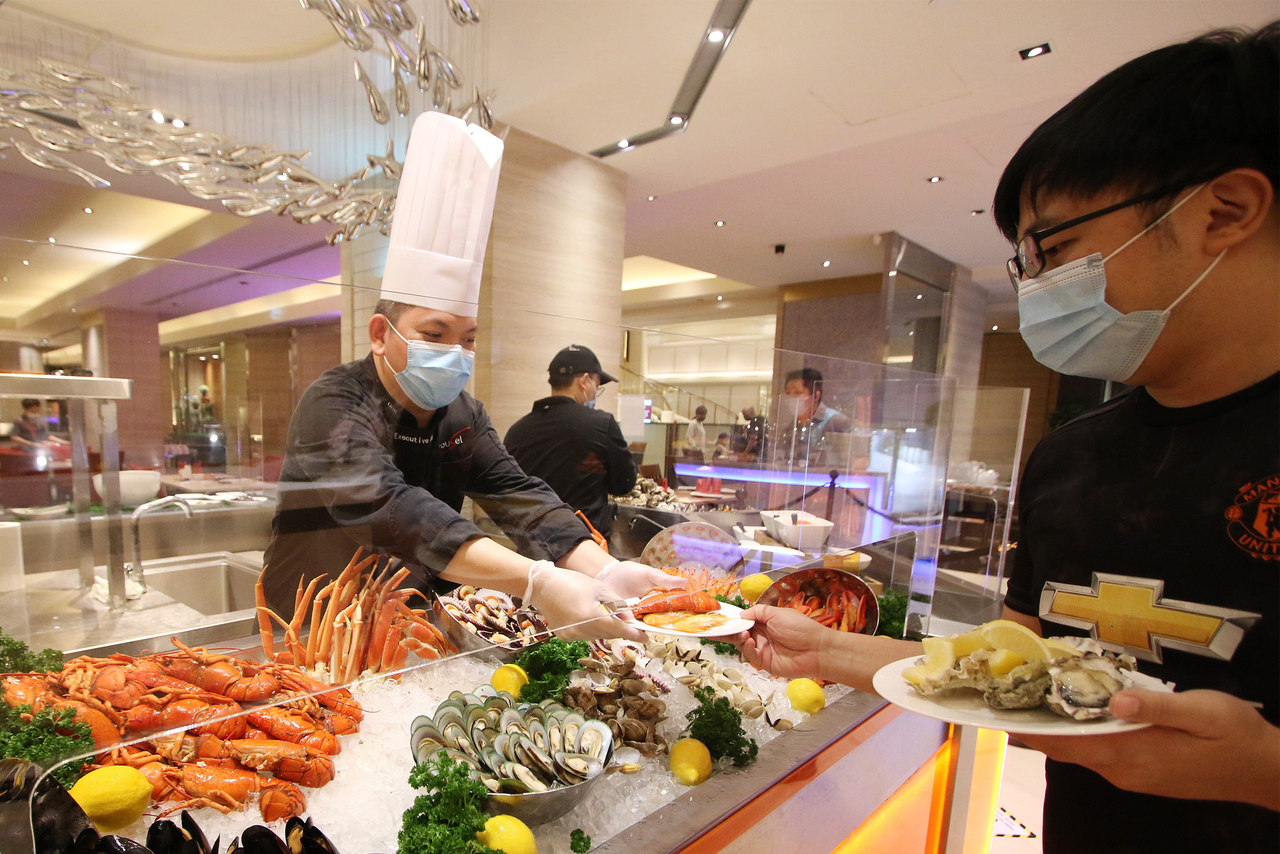 Return of buffets welcome, but S'pore businesses fret about extra costs ...