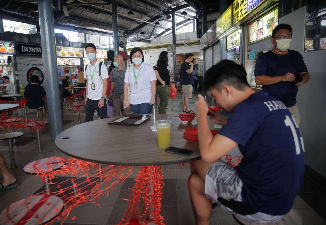 Hawker centre diners clear tables on first day of enforcement but some ...