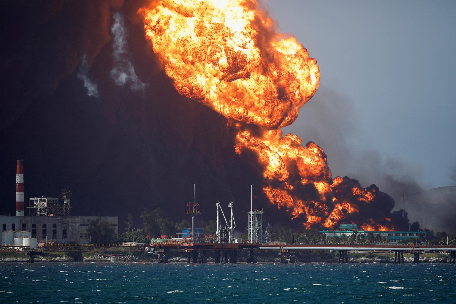 Third fuel tank collapses as helicopters battle Cuban blaze | The ...