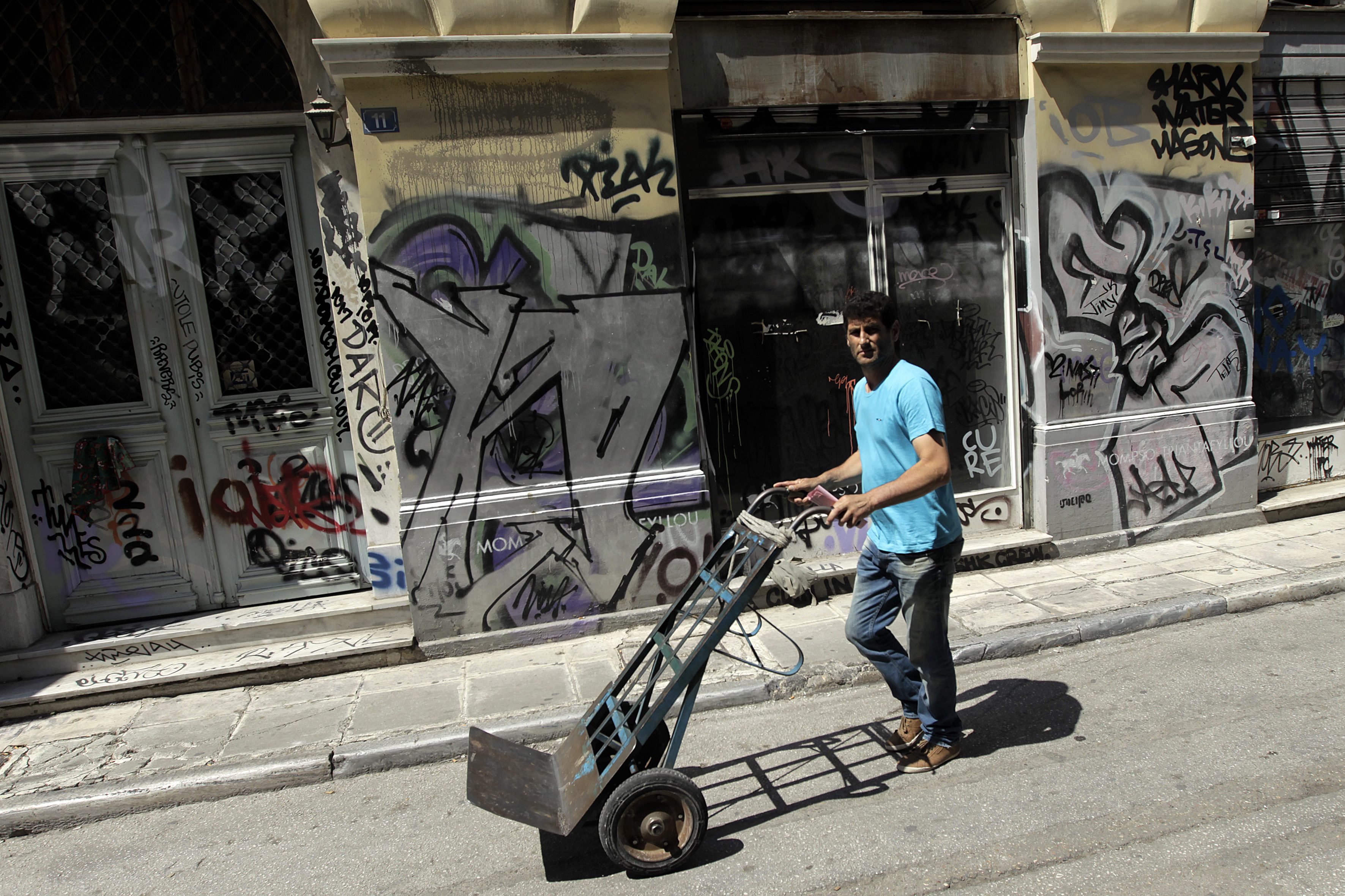 10 pictures that tell the story of the Greek debt crisis | The Straits ...
