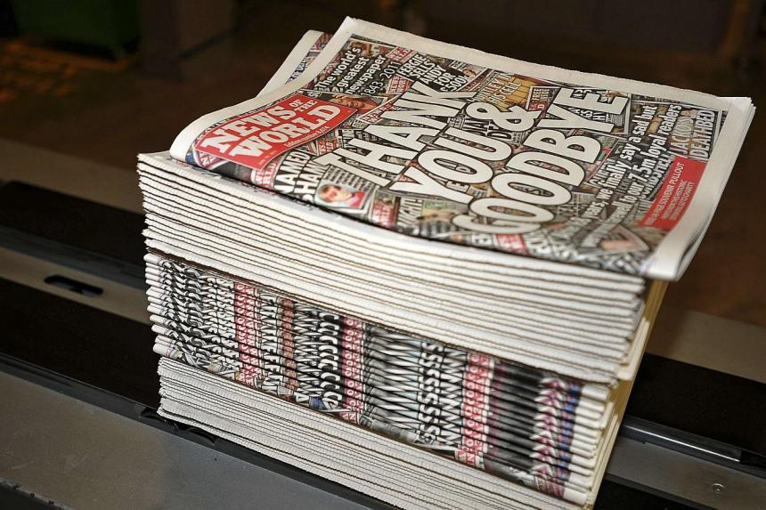 2 more editors from Murdoch British tabloid charged over phone-hacking ...
