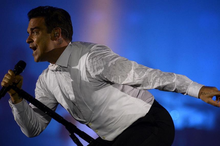 Robbie Williams launches album as former bandmates Take That hit No 1 ...