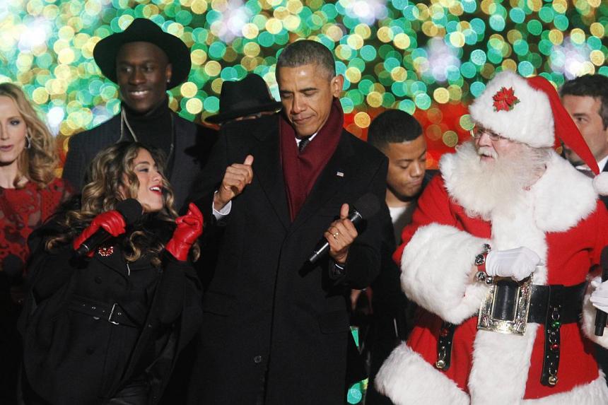 Obama and family usher in Christmas with lighting of national tree ...