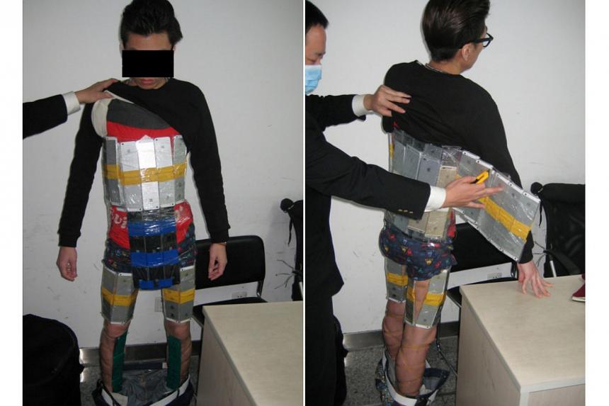 China mocks hapless 'iPhone armour' smuggler | The Straits Times