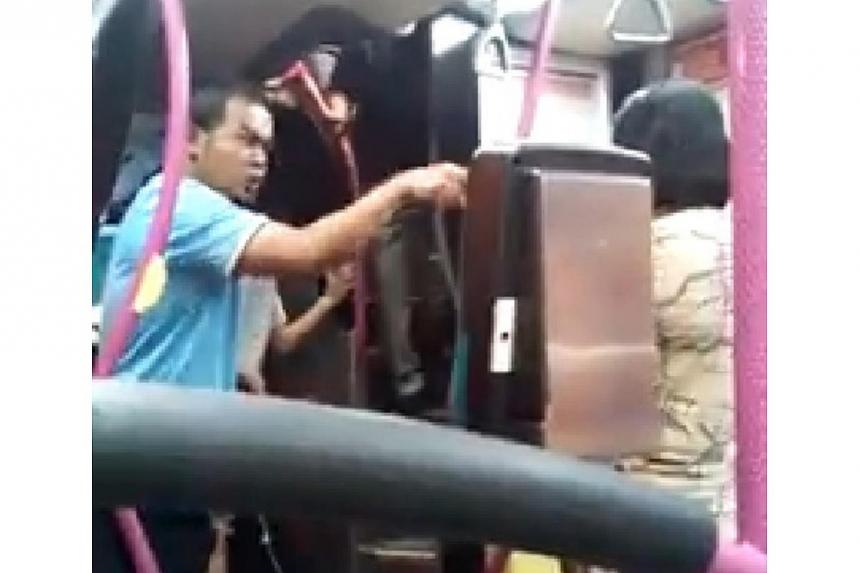Bus commuters exchange angry words | The Straits Times