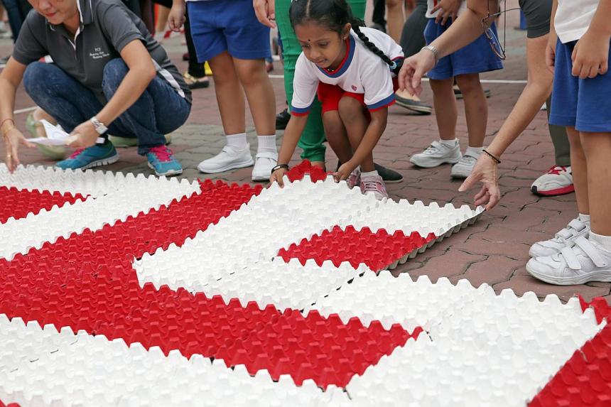 500 pre-schoolers form largest SG50 logo made of recycled egg cartons ...