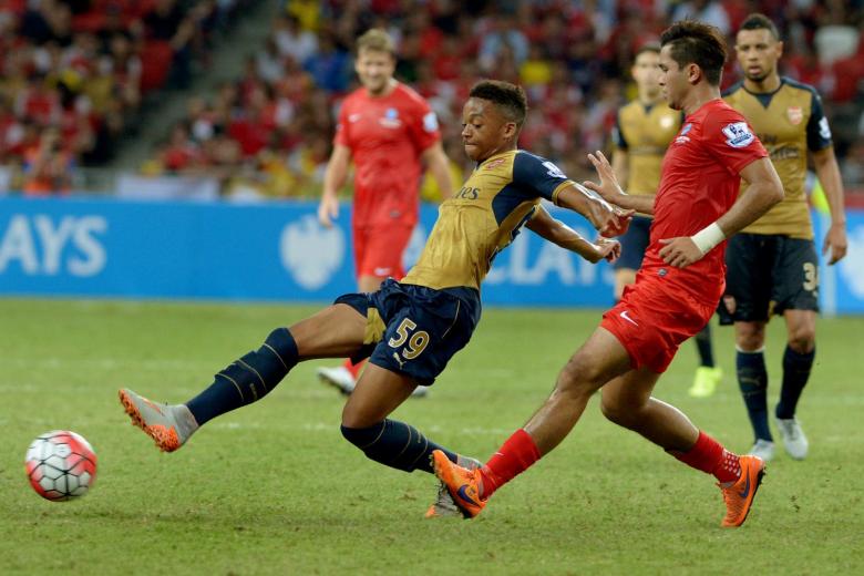 Football: Heat and humidity no obstacle as Arsenal crush Singapore ...