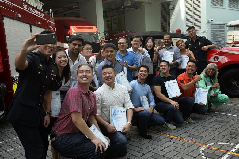 16 people get SCDF awards for lifting trailer truck to free man pinned ...