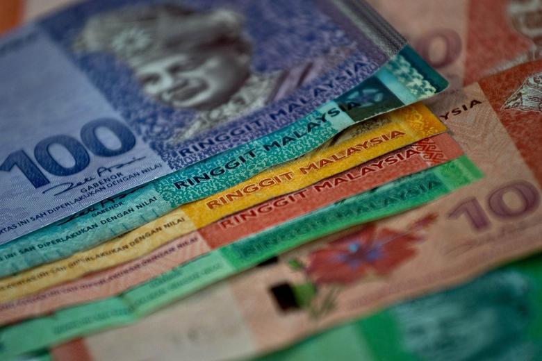 Ringgit stays near 17-year low as Malaysia's forex reserves fall below ...
