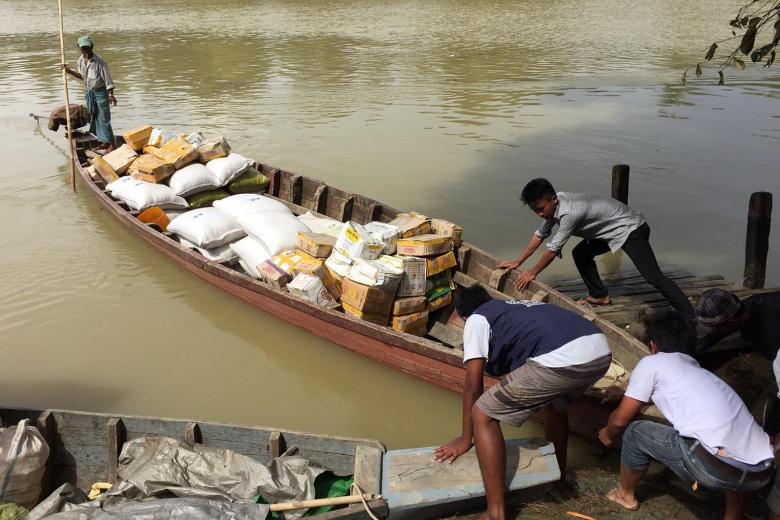 Singapore humanitarian NGO Mercy Relief distributes food aid to flood ...