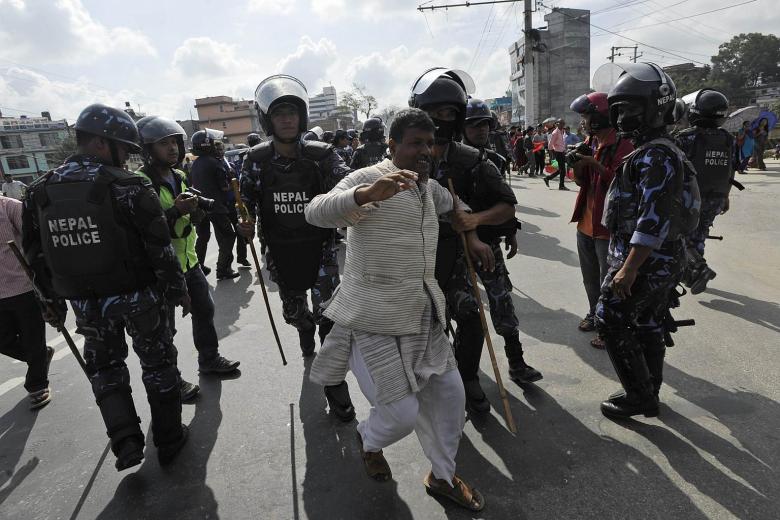 Nepal police arrest dozens of protesters in strike over new ...