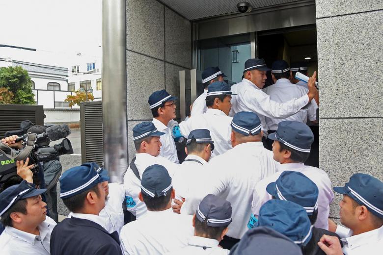Japan police raid splinter yakuza crime group | The Straits Times