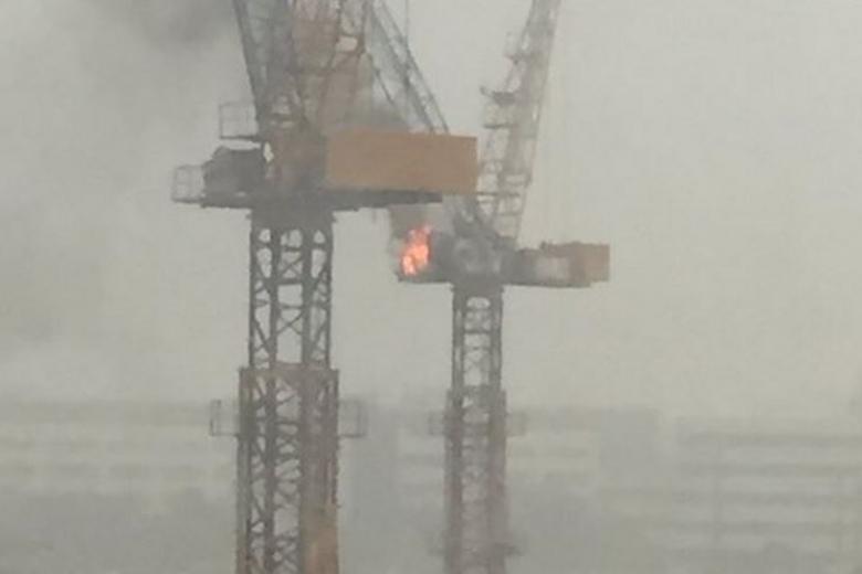 SCDF firefighters scale construction crane in Woodlands to put out fire ...