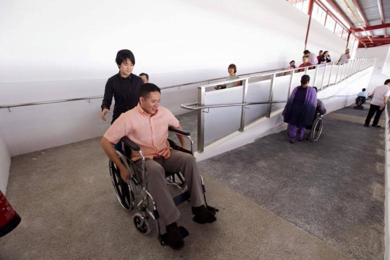 MP tests disabled-friendly temporary Woodlands Bus Interchange - in a ...