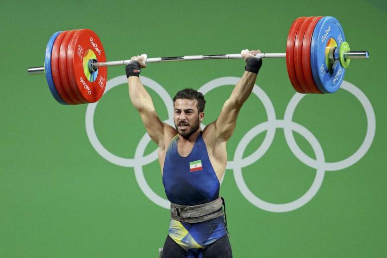 Olympics: Weightlifter Rostami rewrites his own world record to win ...