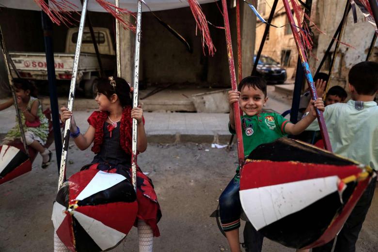 Besieged Syrian kids play with swings made of rockets | The Straits Times