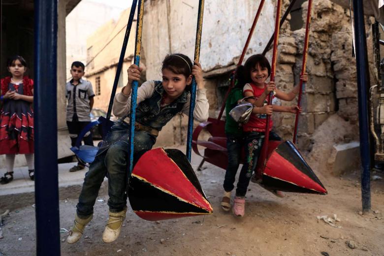 Besieged Syrian kids play with swings made of rockets | The Straits Times