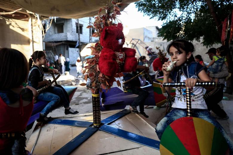 Besieged Syrian kids play with swings made of rockets | The Straits Times