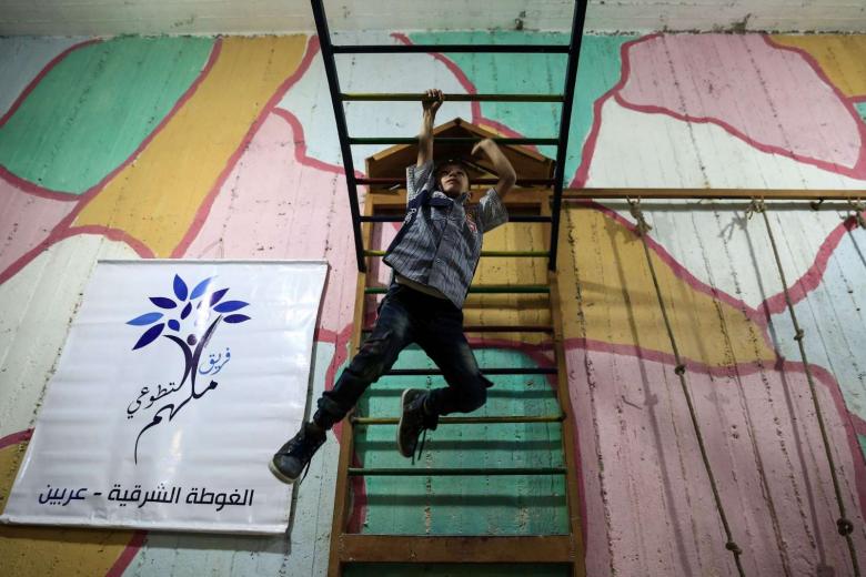 Besieged Syrian kids play with swings made of rockets | The Straits Times