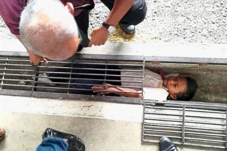 Boy trapped in drain for 20 minutes in Malaysia while trying to ...