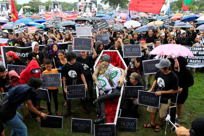 Thousands of anti-Marcos activists stage 'Black Friday' protest across ...